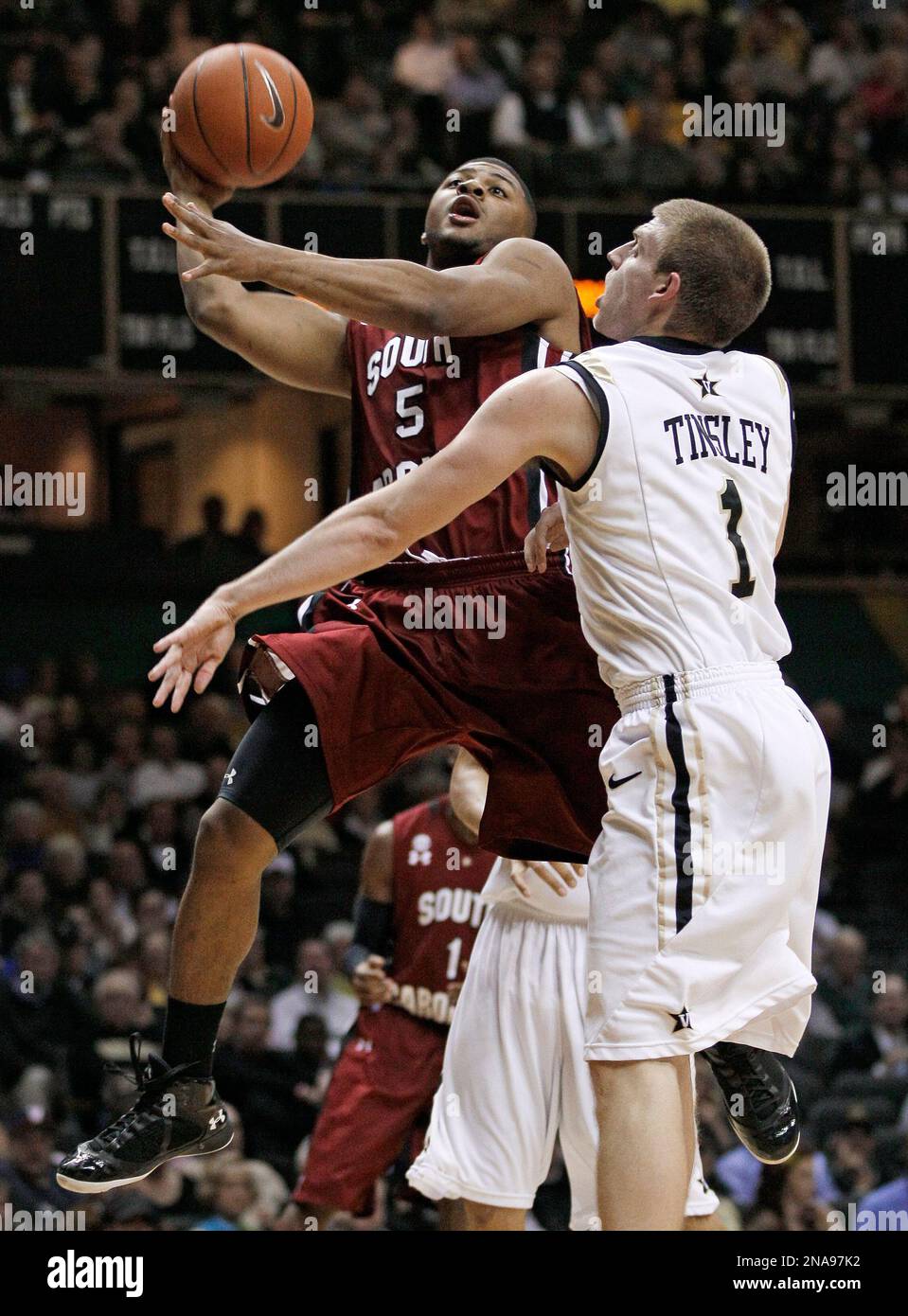 South Carolina guard Eric Smith (5) drives against Vanderbilt guard ...