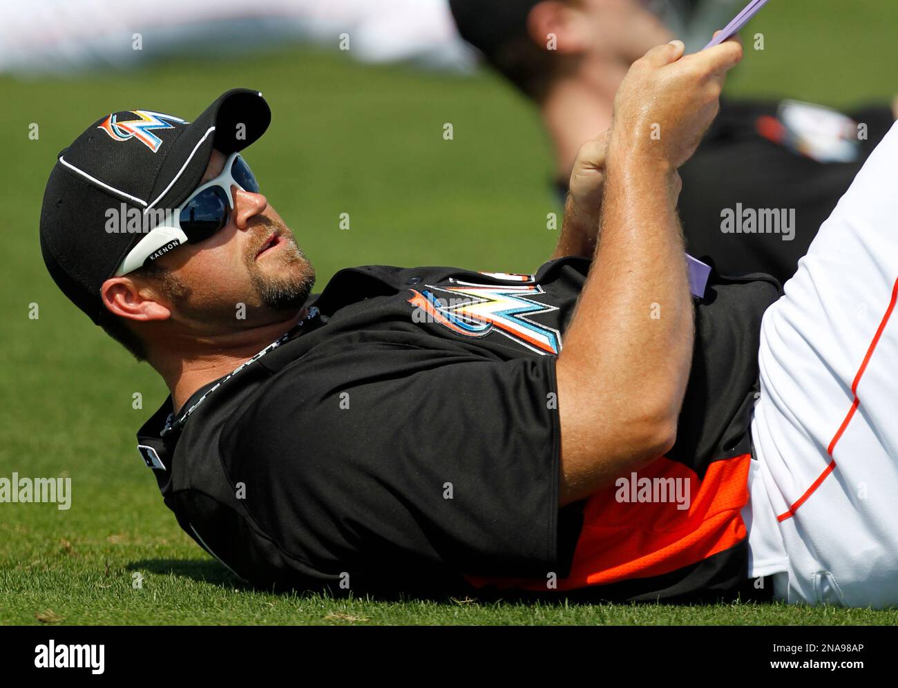 Miami Marlins pitcher Heath Bell stretches during spring training ...
