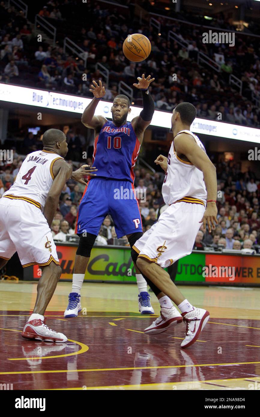 Detroit Pistons' Greg Monroe (10) passes over Cleveland Cavaliers ...