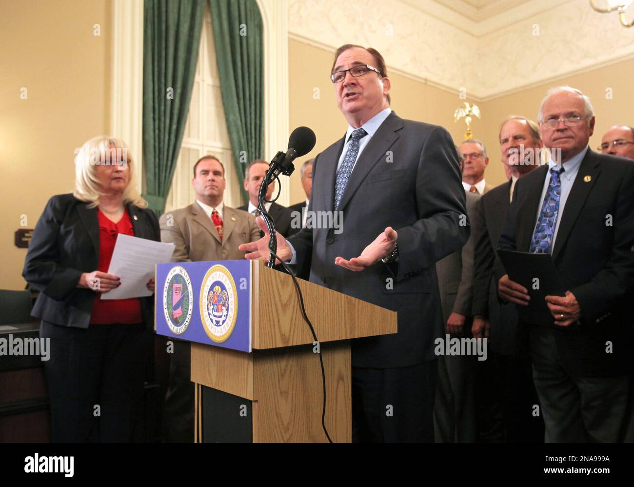 Senate Minority Leader Bob Huff, of Diamond Bar, center, answers a ...