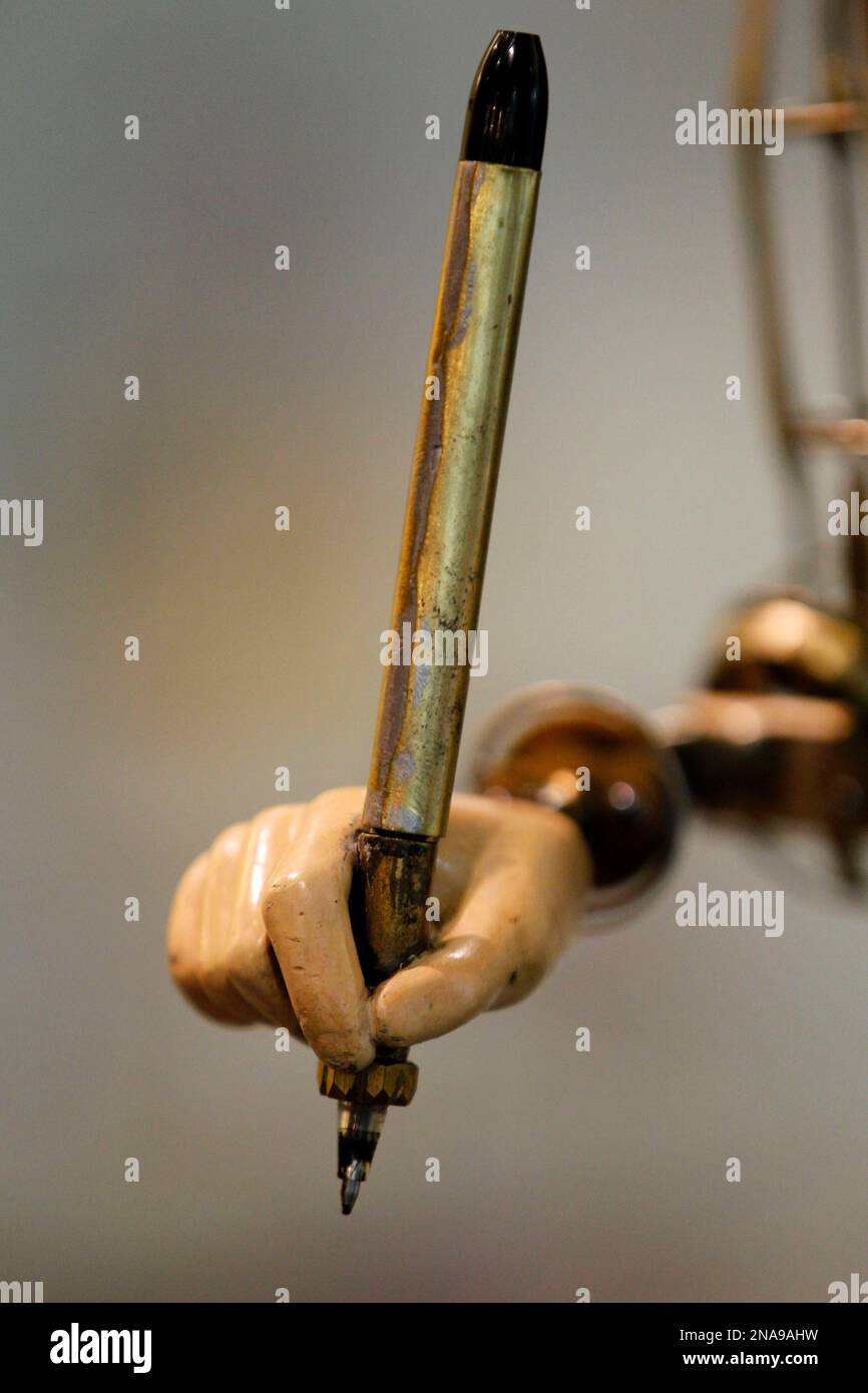 In this Tuesday, Feb. 14, 2012 photo, the hand and pen of an ...