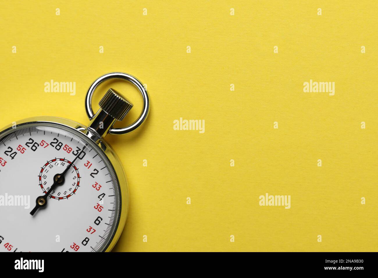 Vintage timer on yellow background, top view. Space for text Stock ...