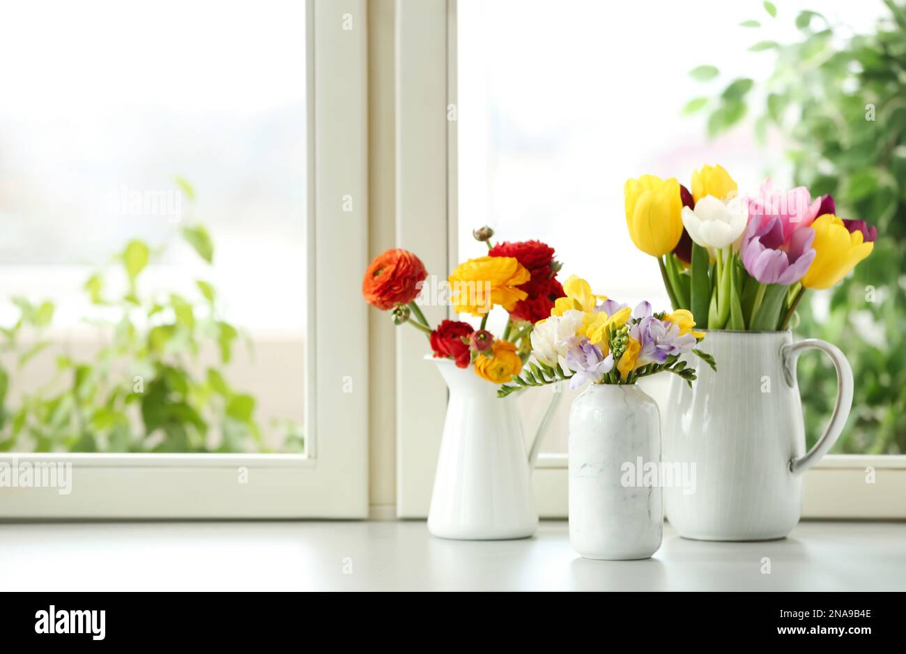 Different beautiful spring flowers on window sill. Space for text Stock ...