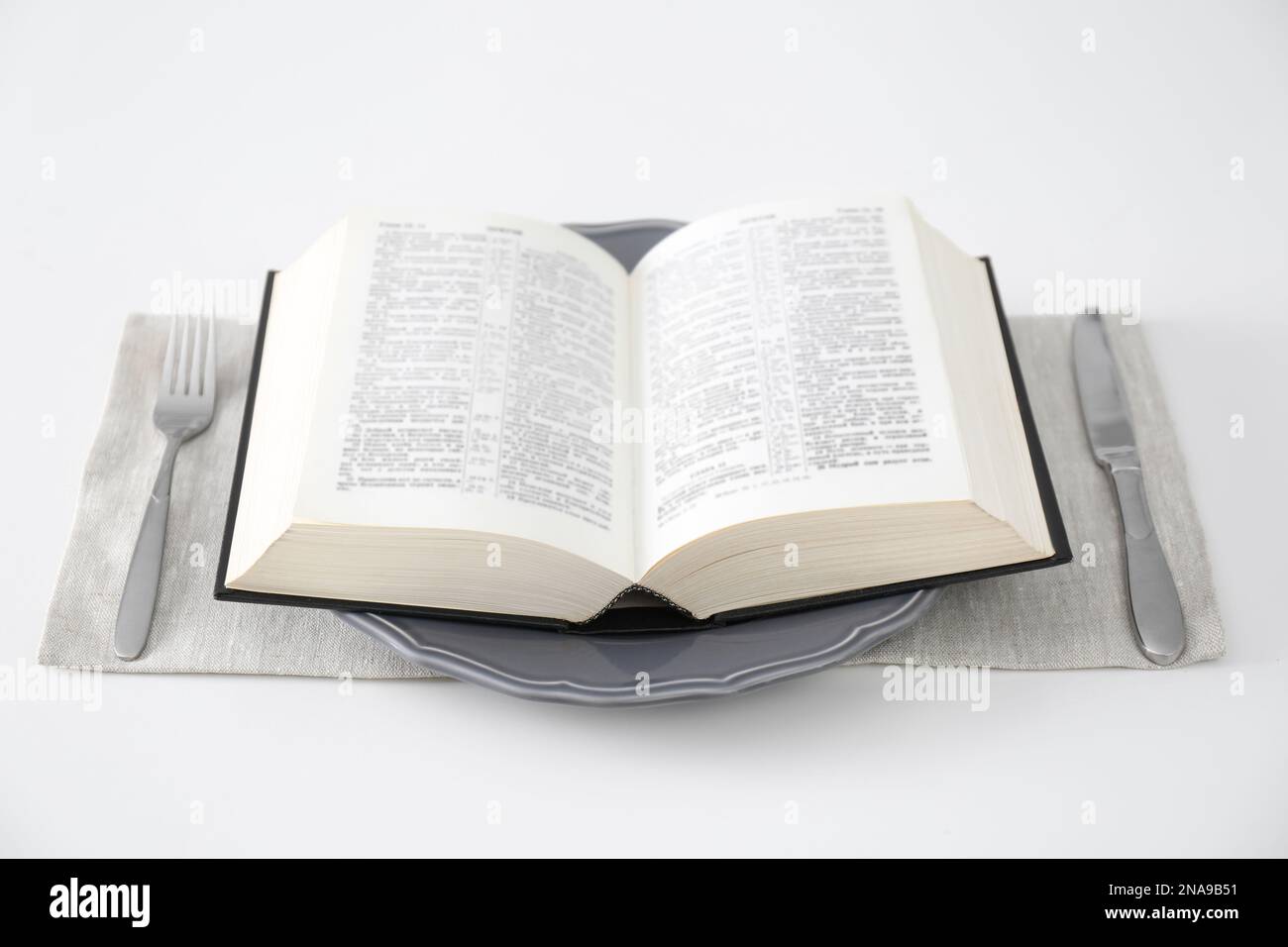 Table setting with Holy Bible on white background. Great Lent season ...