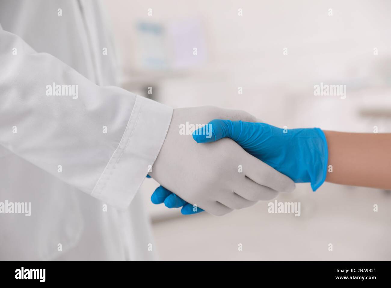 Surgical gloves handshake hi-res stock photography and images - Alamy