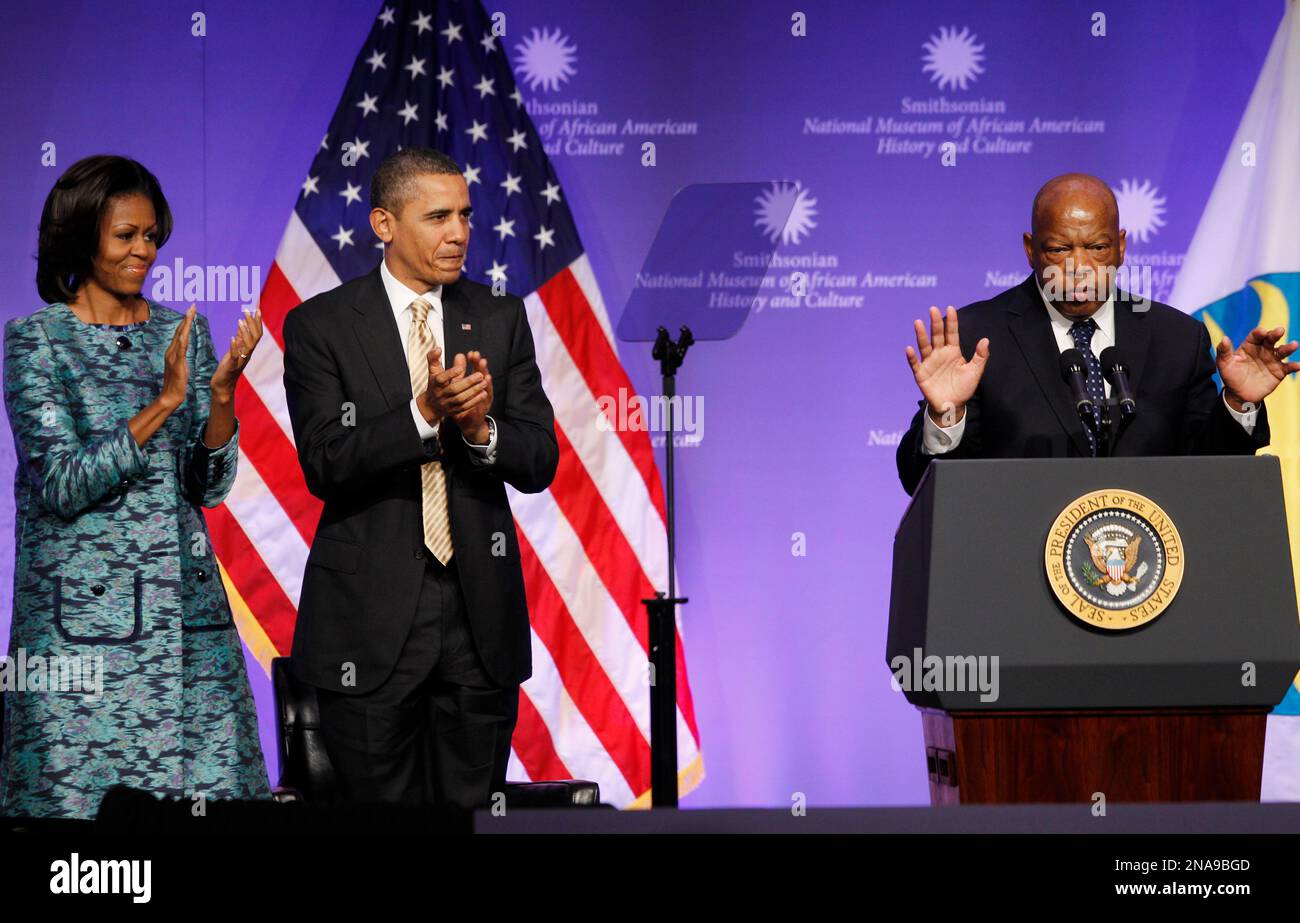 President Barack Obama and first lady Michelle Obama applaud as Rep ...
