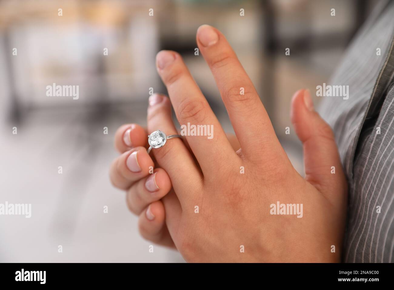 Woman taking off wedding ring indoors, closeup. Divorce concept Stock ...