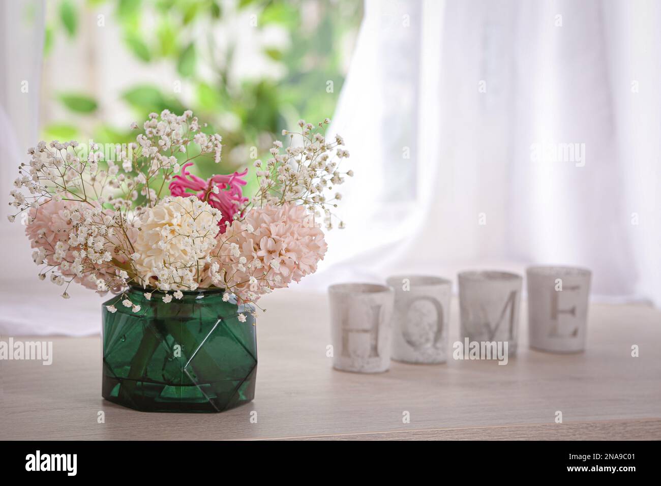 Beautiful fresh flowers on window sill indoors Stock Photo - Alamy