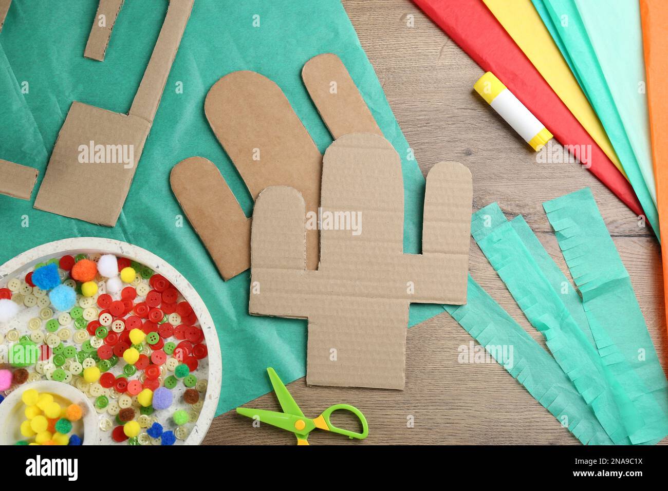 Materials and tools on wooden table, flat lay. Cactus pinata DIY Stock ...