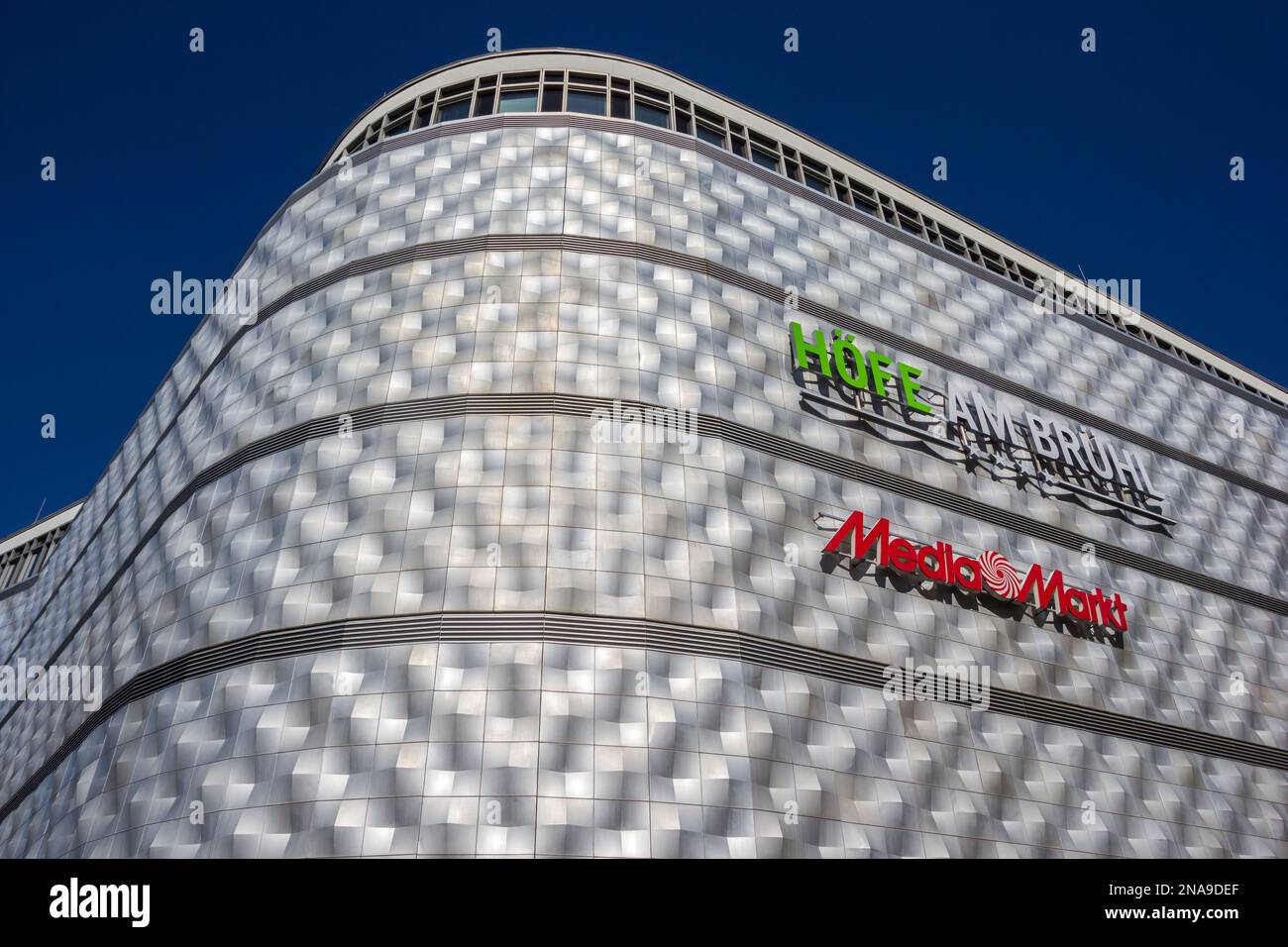 Silver facade with shop names of a shopping center in Leipzig, Germany ...