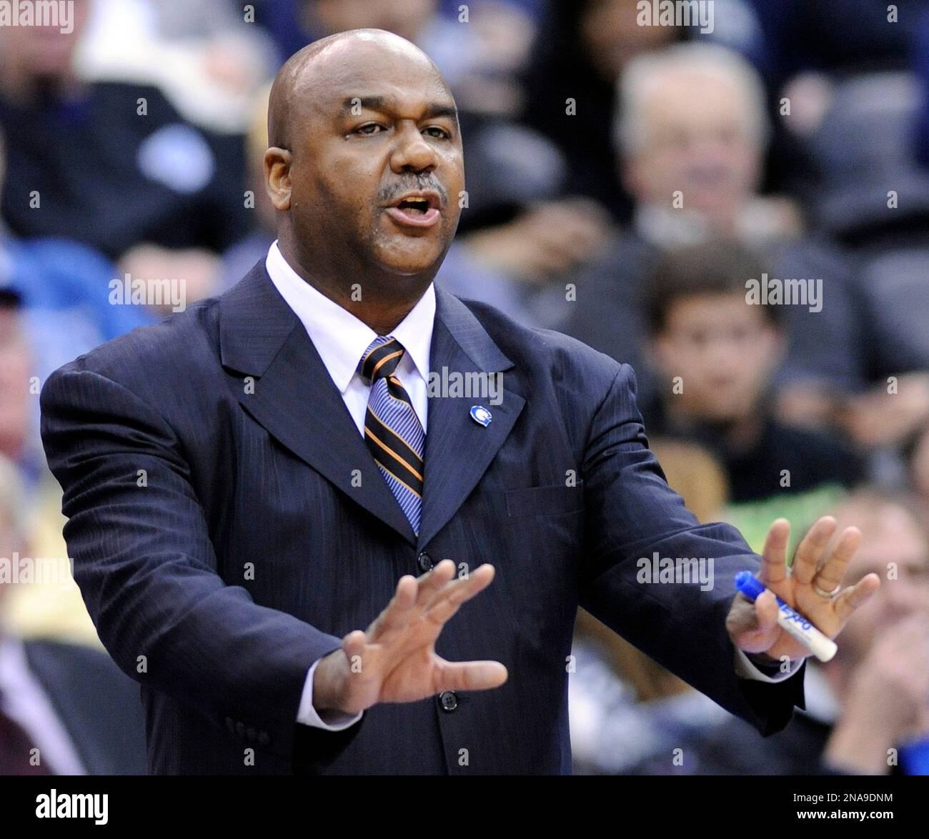 Georgetown coach John Thompson III signals to his team during the first ...