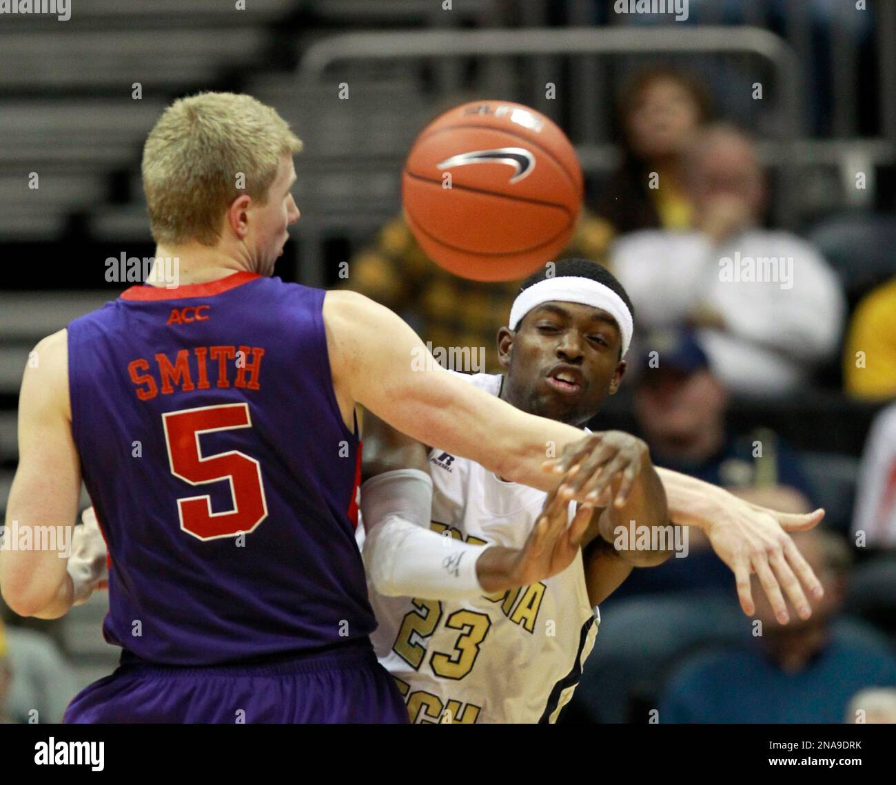 Georgia Tech guard Brandon Reed (23) passes around Clemson guard Tanner ...