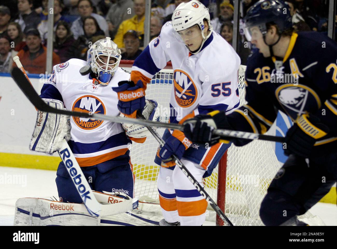 New York Islanders goalie Kevin Poulin makes a save on a shot as ...
