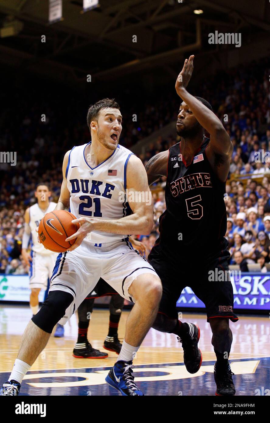 Duke's Miles Plumlee, left, drives to the basket against North Carolina ...