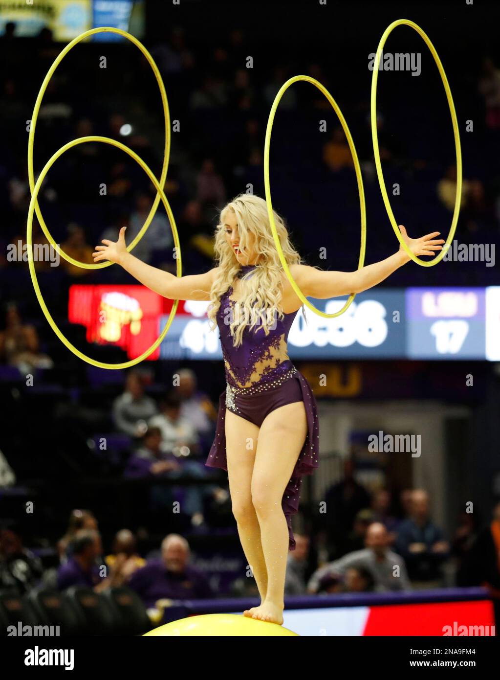 Cirque entertainment artist Grace Good performs during halftime of a ...