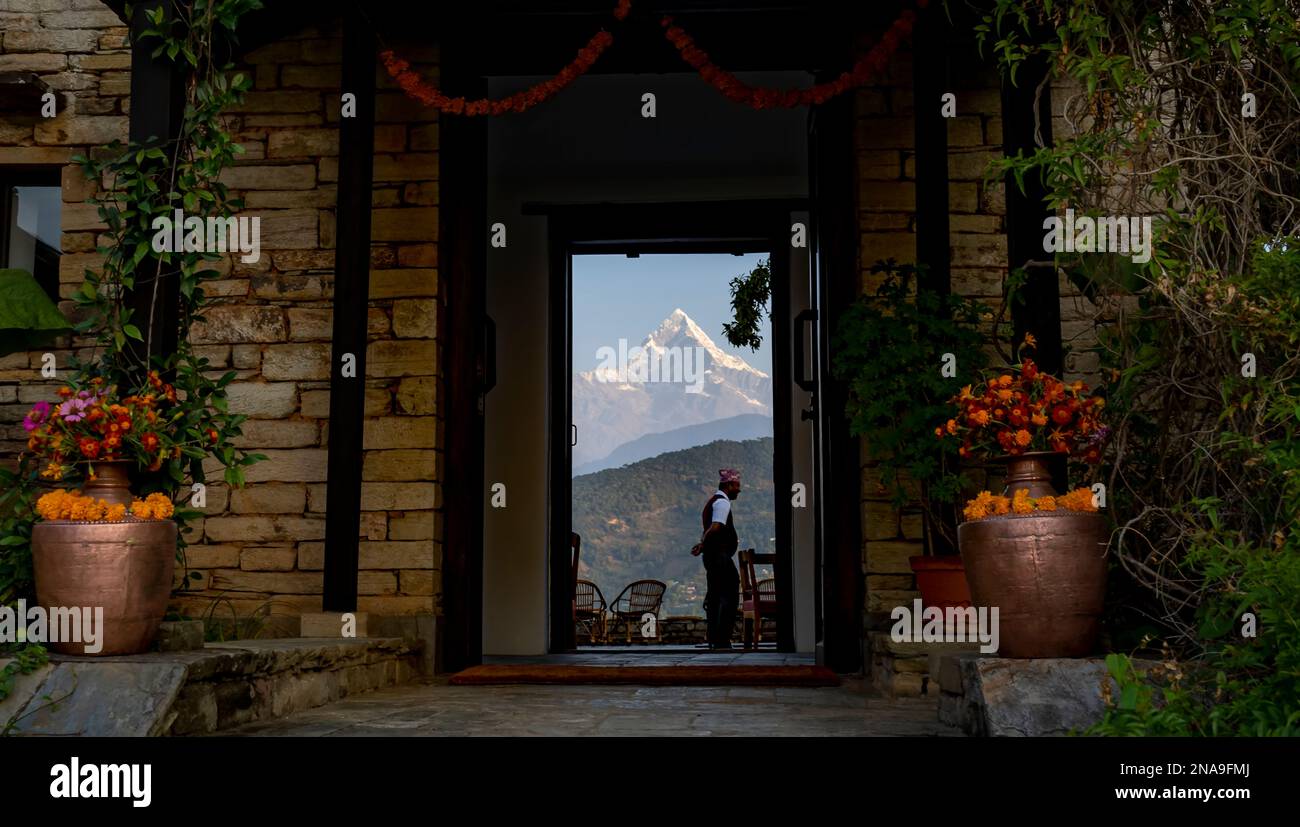 Machhapuchhare Peak, the Fish Tail Mountain through doorway of mountain ...