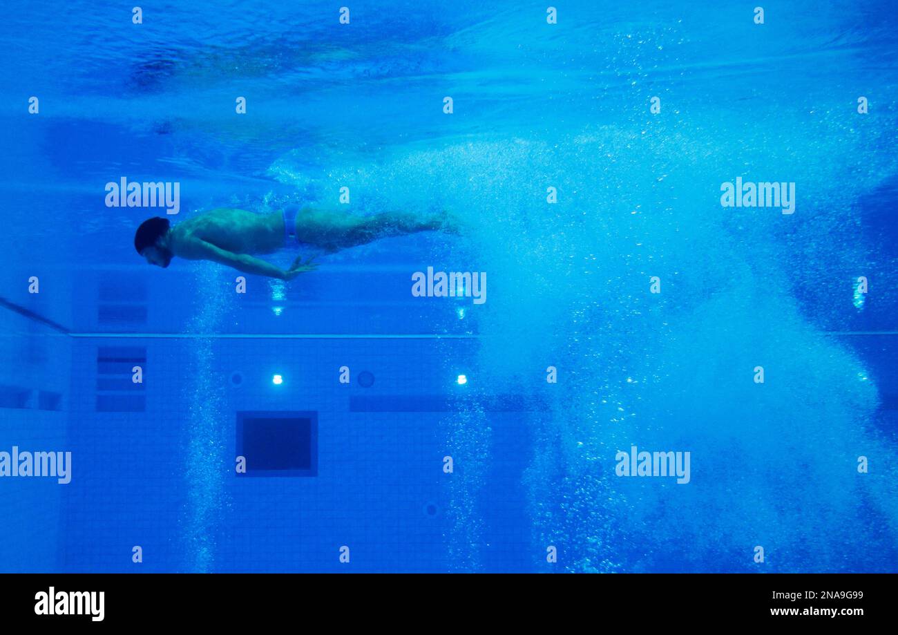 Italy's Tommaso Rinaldi is seen through the glass of a viewing window ...