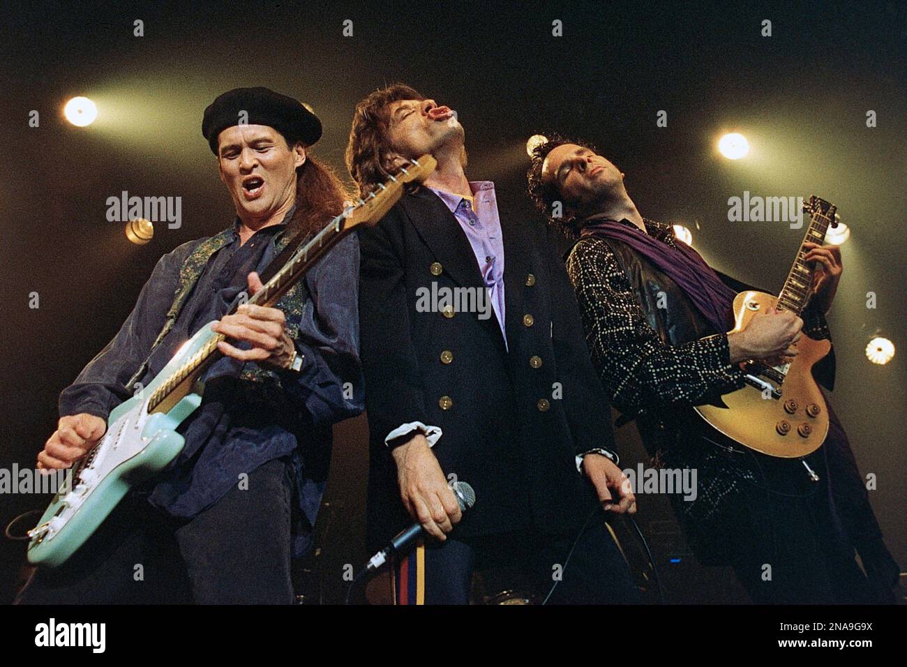 Mick Jagger, center, performs a song from his new solo album “Wandering ...