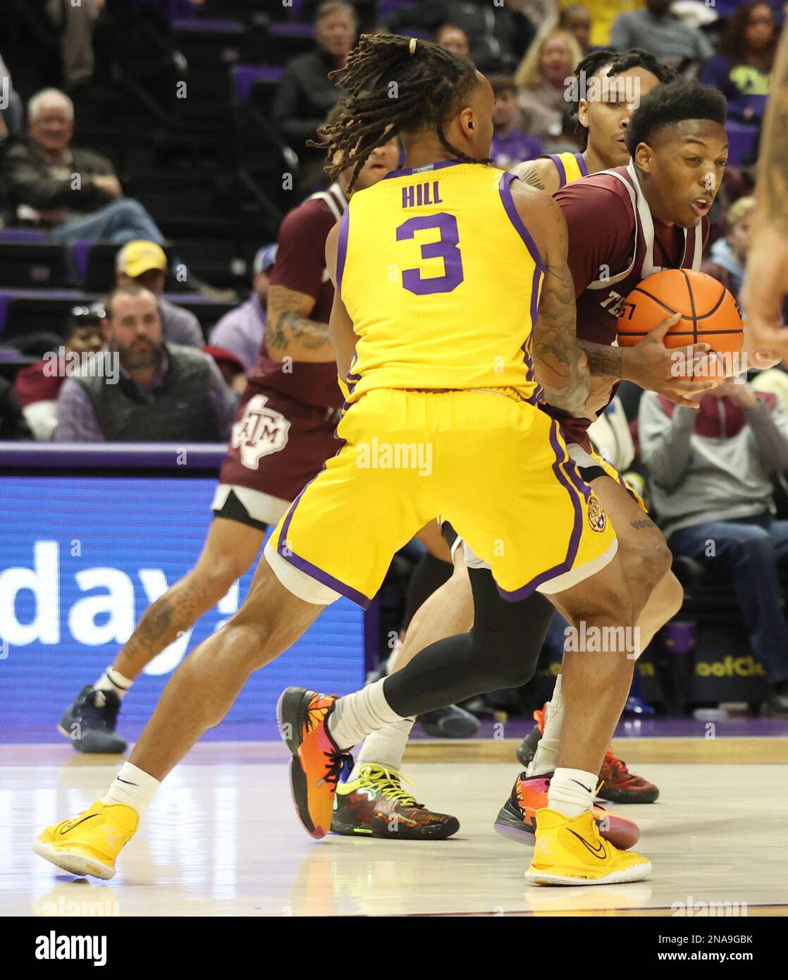 Texas A&M Aggies guard Wade Taylor IV (4) tries to make a move on LSU Tigers guard Justice Hill ...