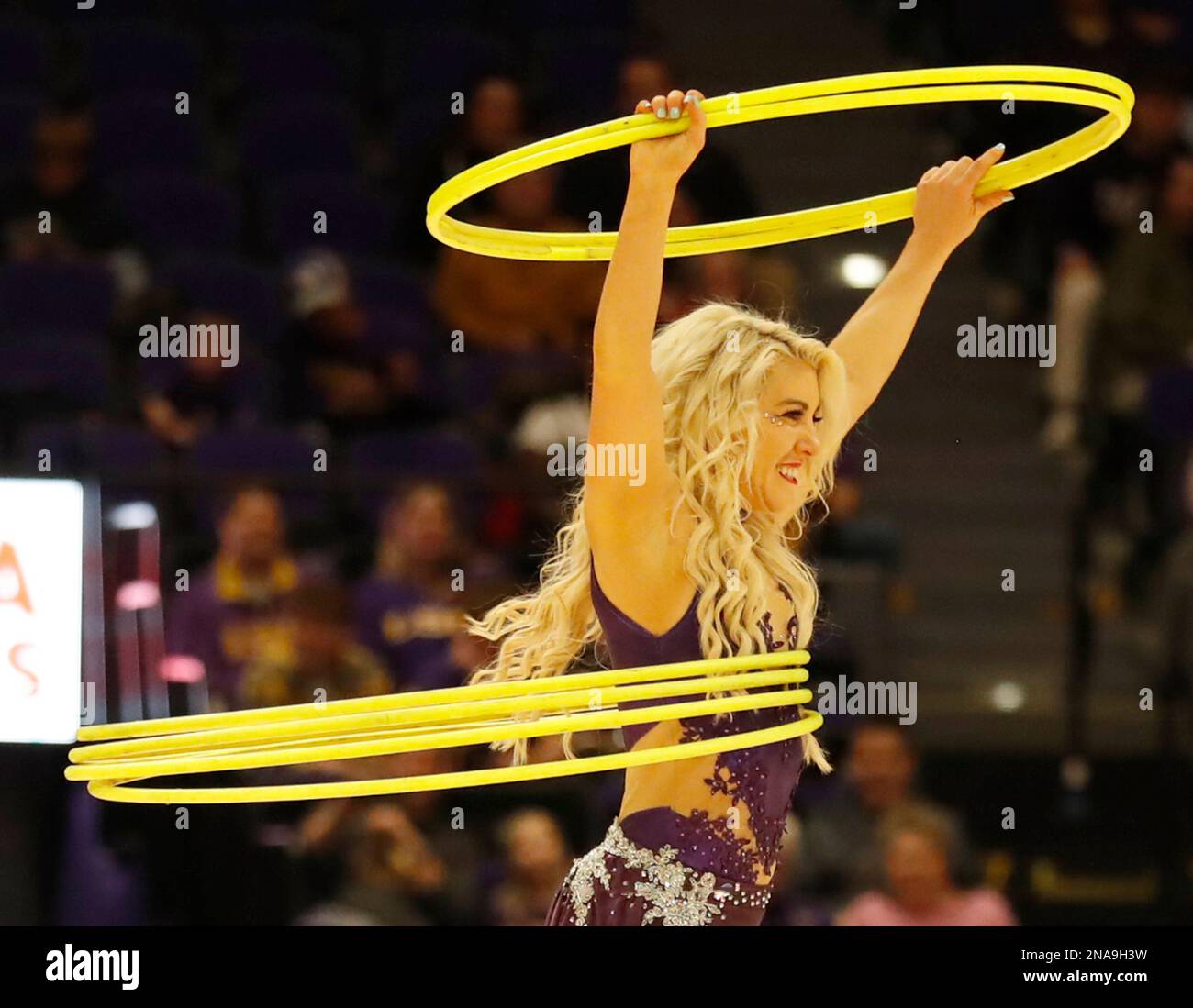 Cirque entertainment artist Grace Good performs during halftime of a ...