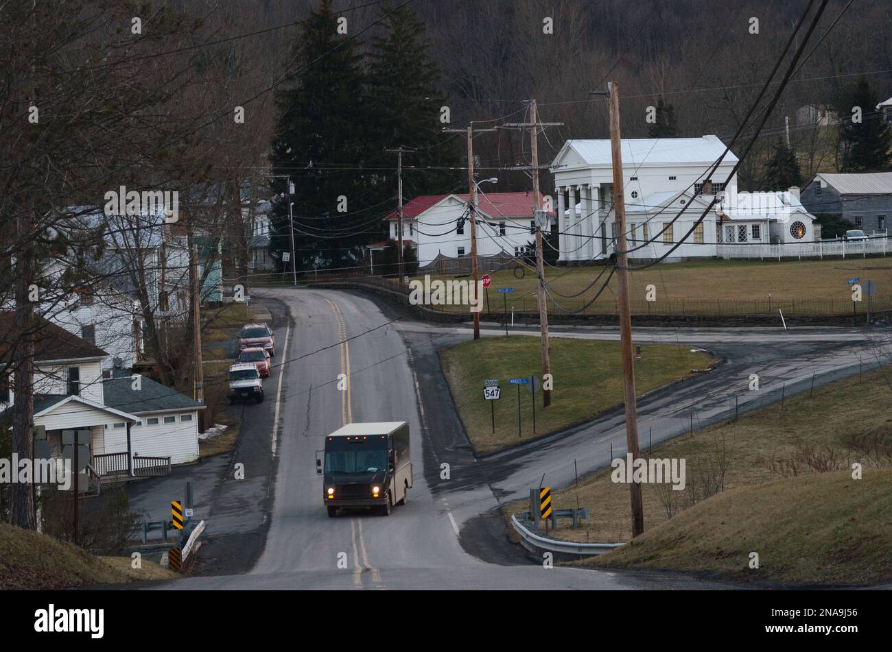 In this photo taken Feb. 1, 2012, a delivery truck moves along the ...