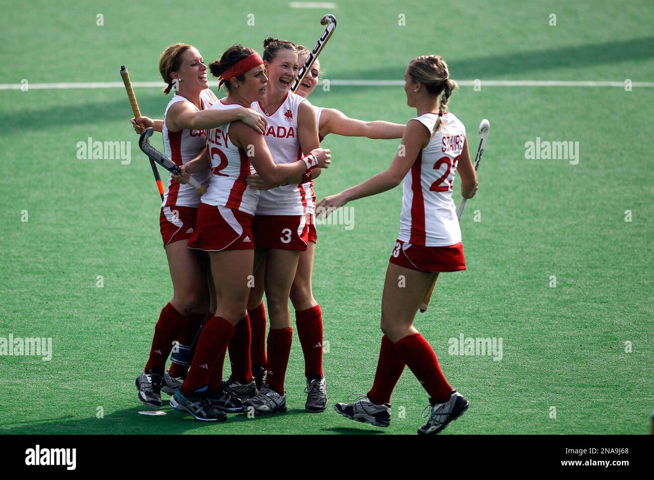 Canadian women's team members rejoice after scoring a goal against ...