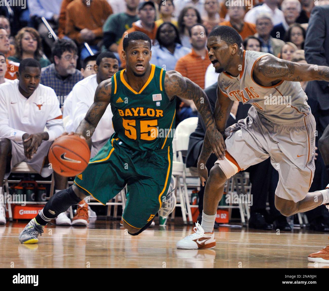 Baylor guard Pierre Jackson, left, drives around Texas guard Julien ...