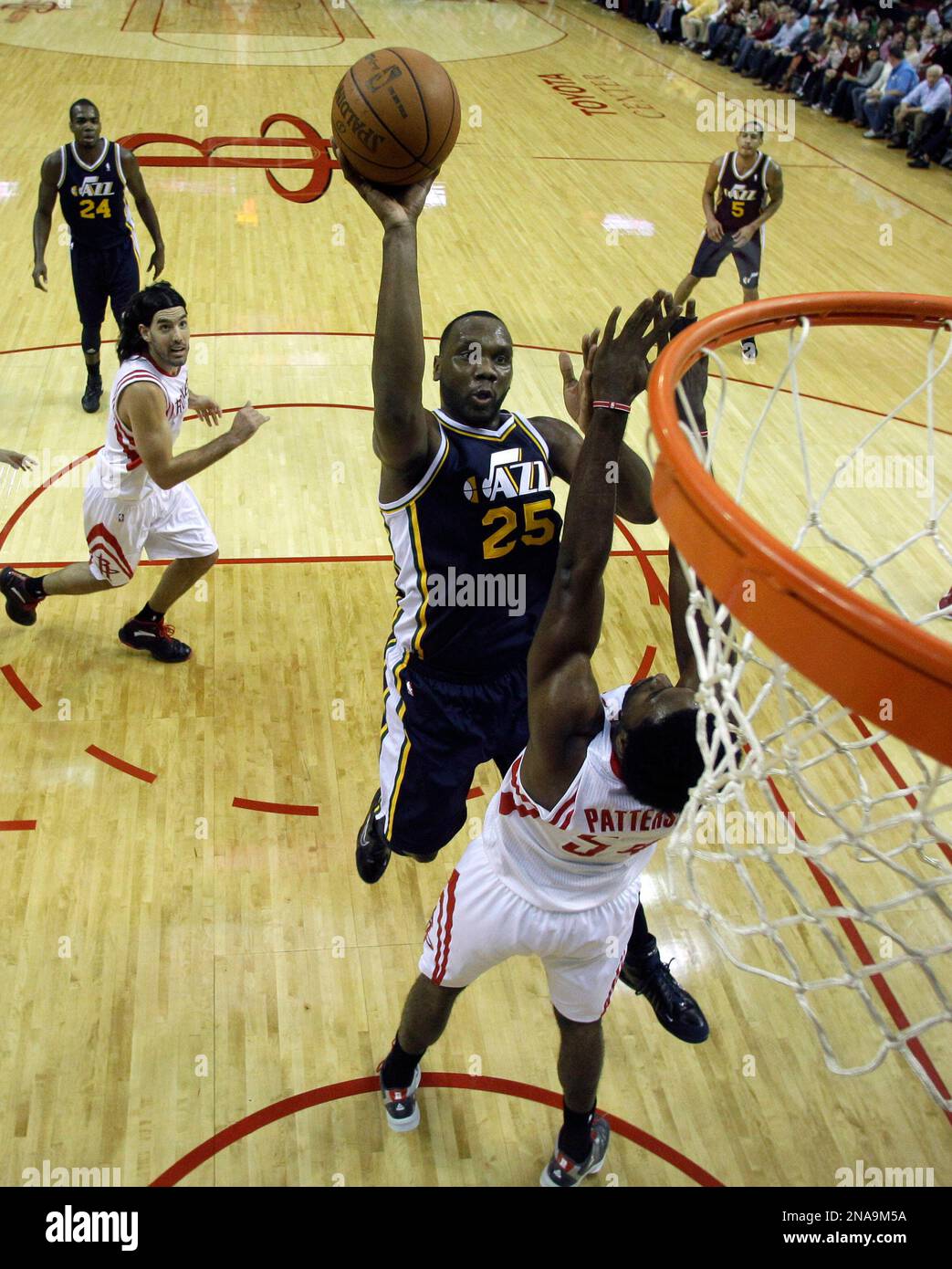 Utah Jazz's Al Jefferson (25) shoots over Houston Rockets' Patrick ...