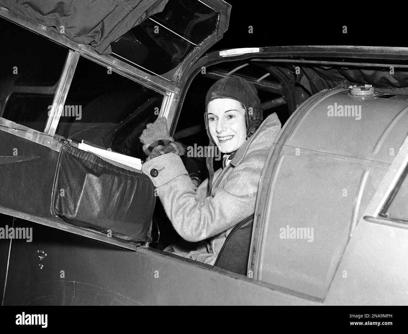 New Zealand's Jean Batten in the cockpit of her plane just before ...
