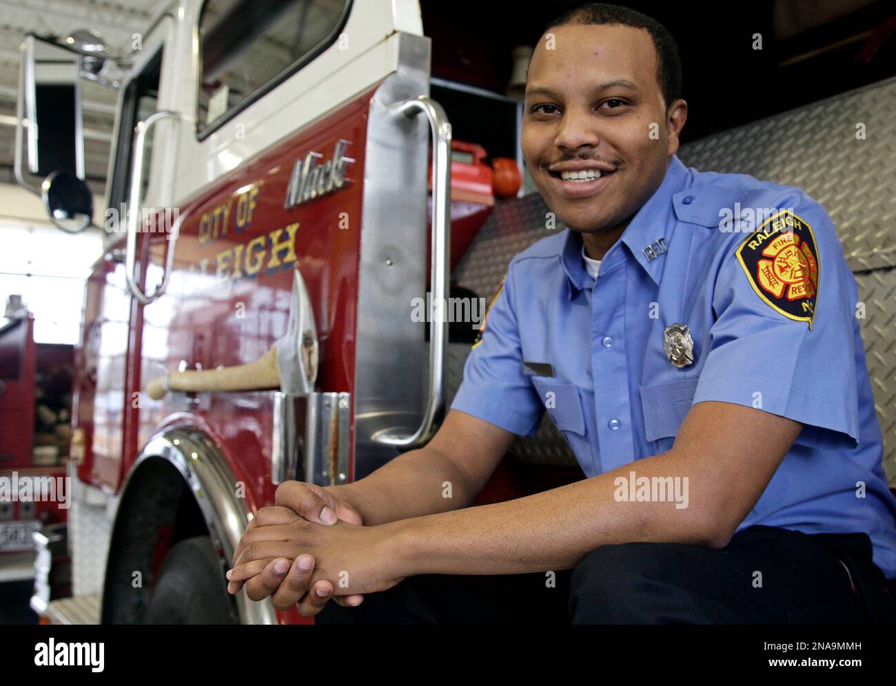 In this Tuesday, Feb. 14, 2012 photo, Raleigh firefighter Chaz Moore ...