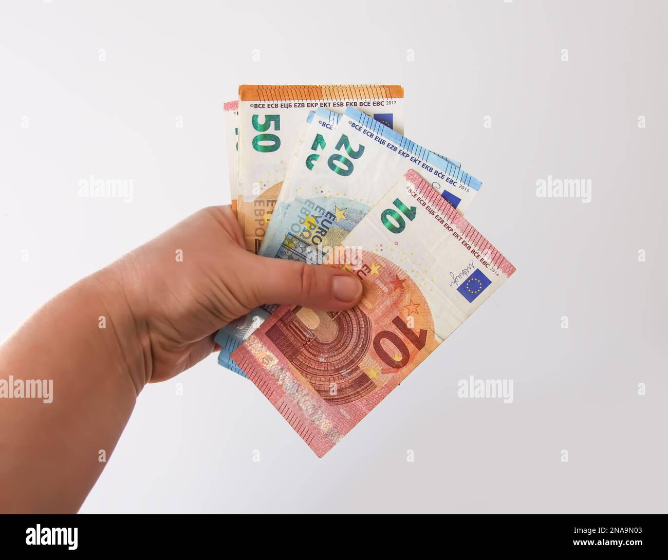 Wallet with euro money banknotes in a hand Stock Photo - Alamy