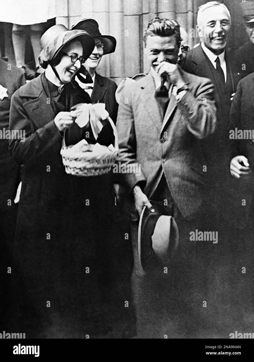 Britain's Prince of Wales samples a doughnut given him by Miss Eunice ...