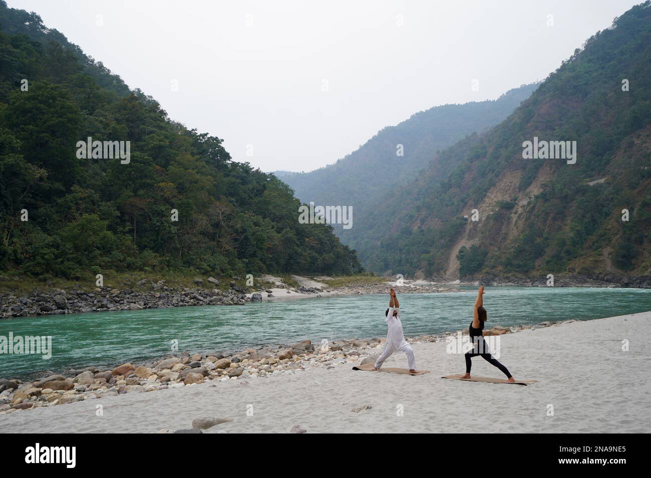 Yoga Class on the bank of the River Ganges flowing through the ...