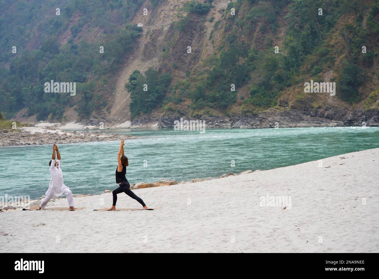 Yoga Class on the bank of the River Ganges flowing through the ...
