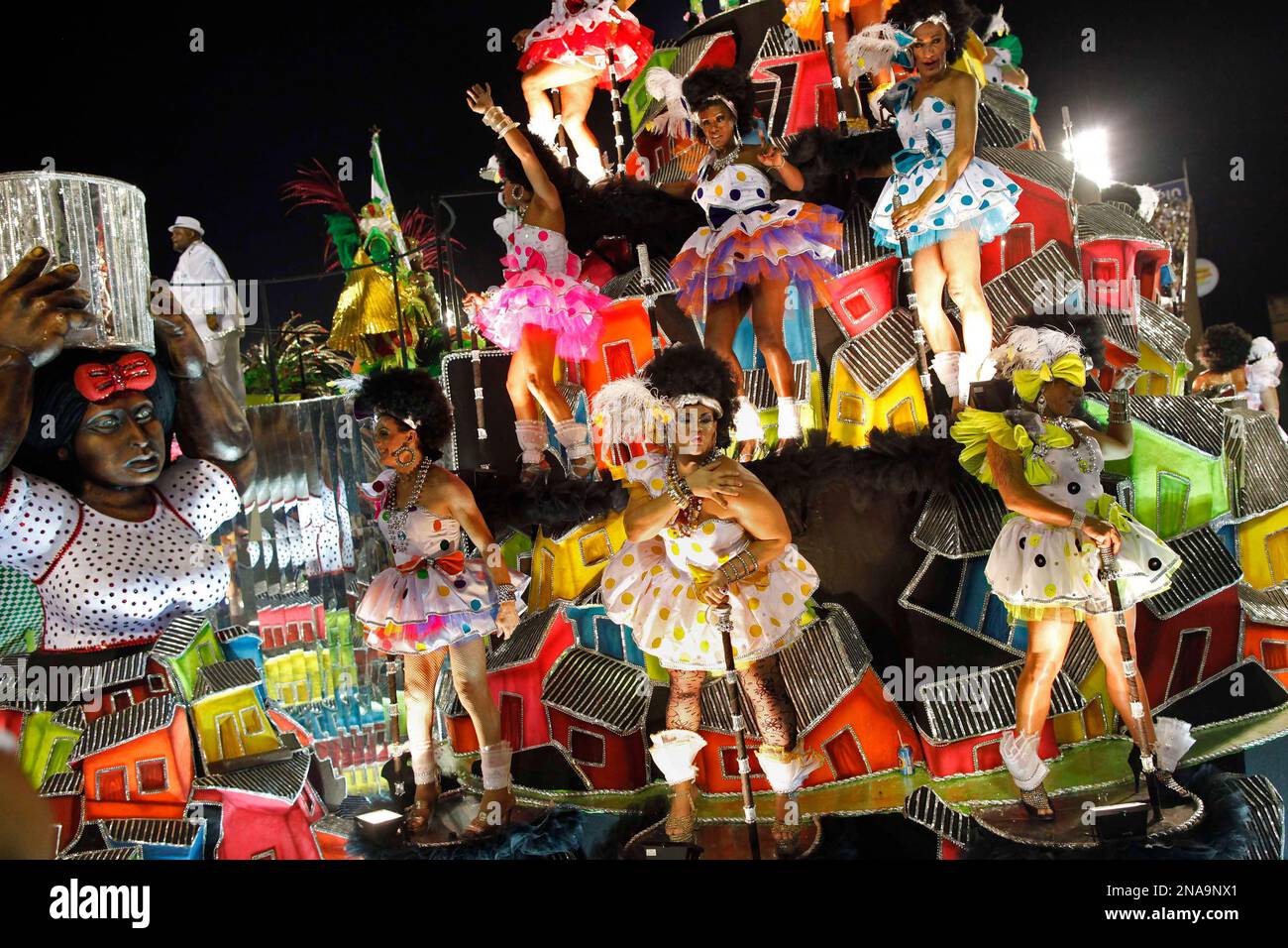 Dancers from the Mocidade samba school parade on a float during ...