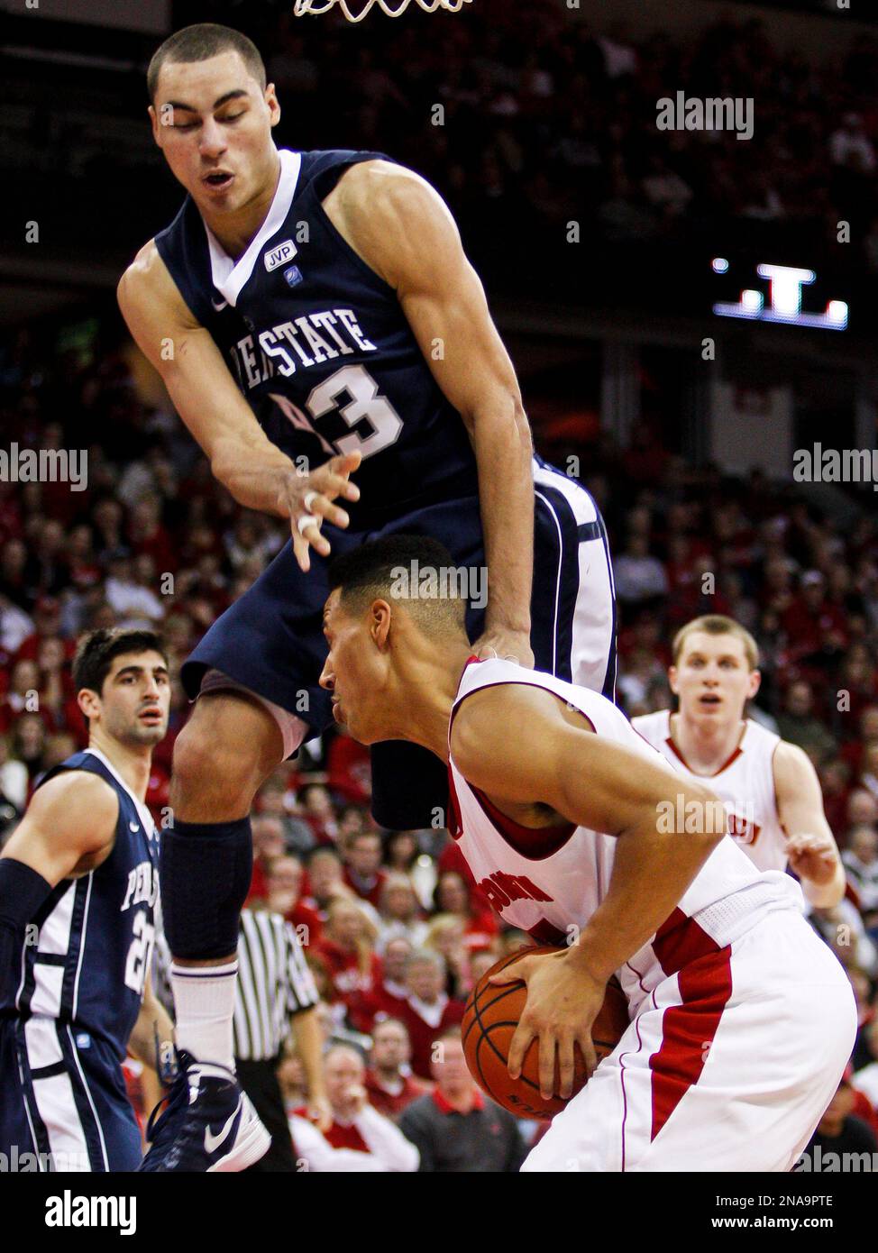 Penn State's Travis Ross, top, fouls Wisconsin's Ryan Evans during the ...