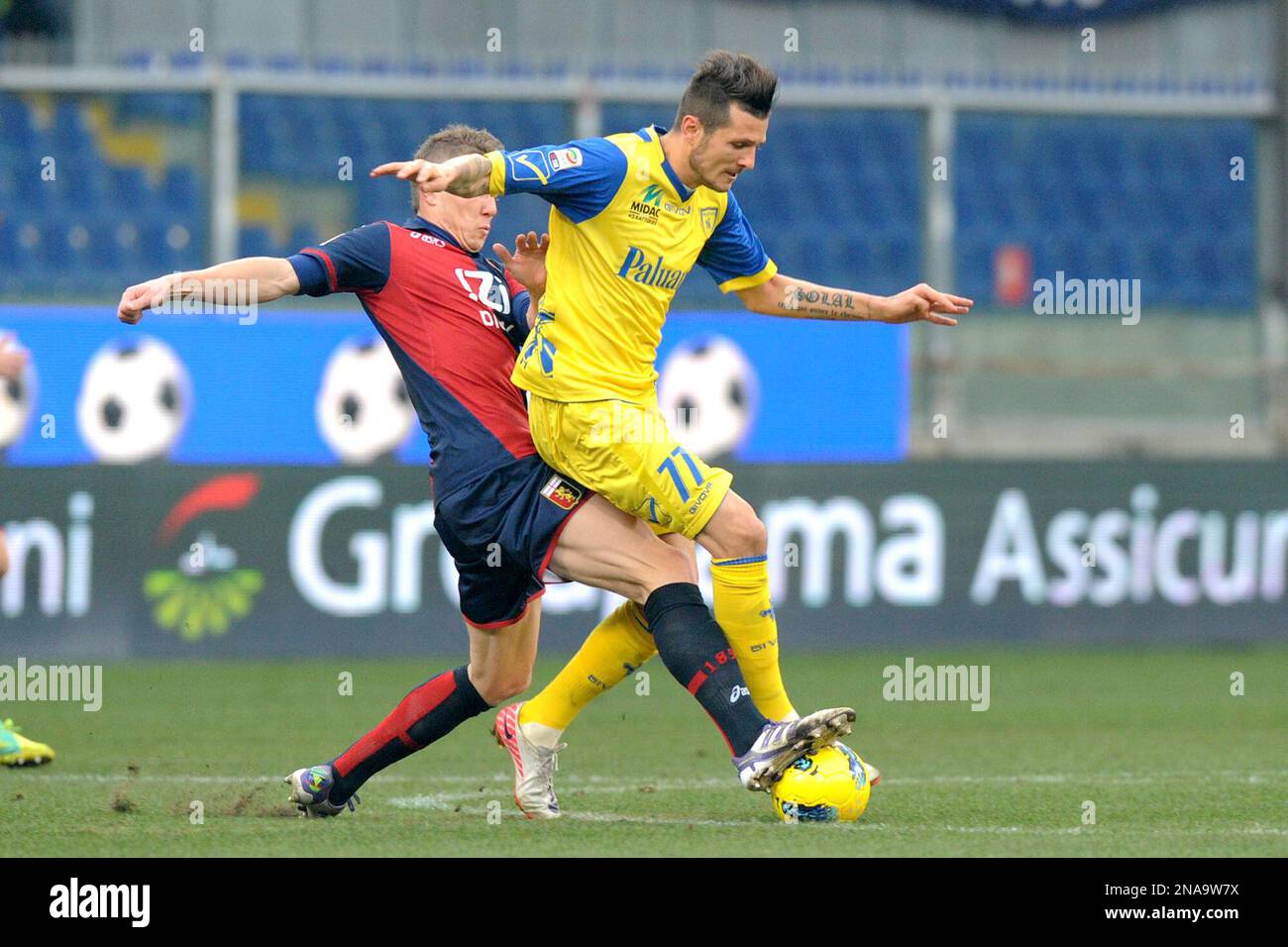 Chievo forward Cyril Thereau, of France, right, vies for the ball with ...