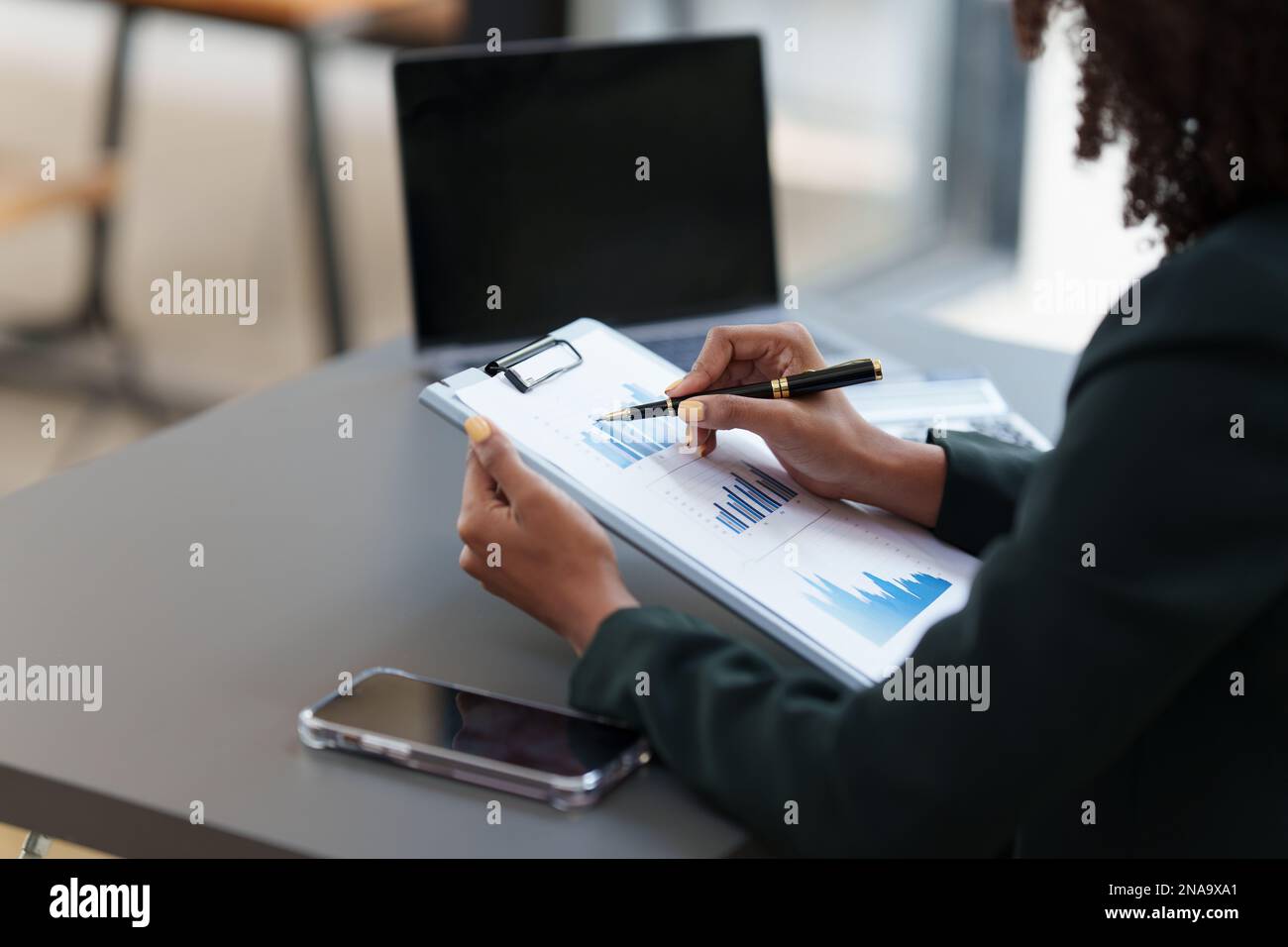 Accountant black woman working on laptop and do document, tax, exchange ...