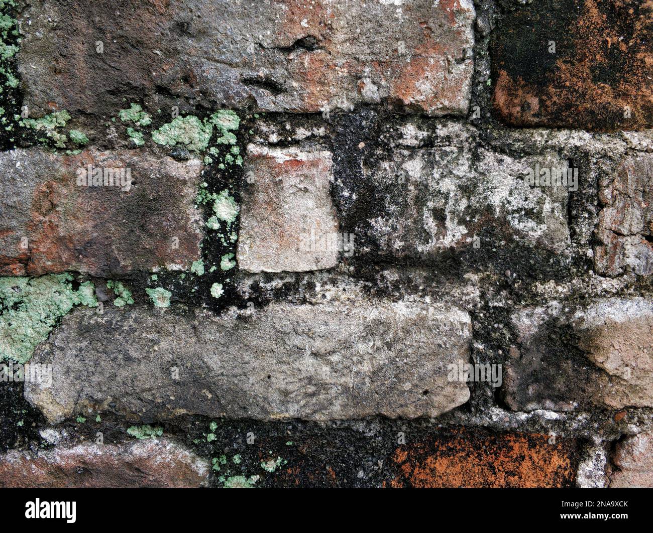Texture of a brick wall with signs of fire Stock Photo - Alamy