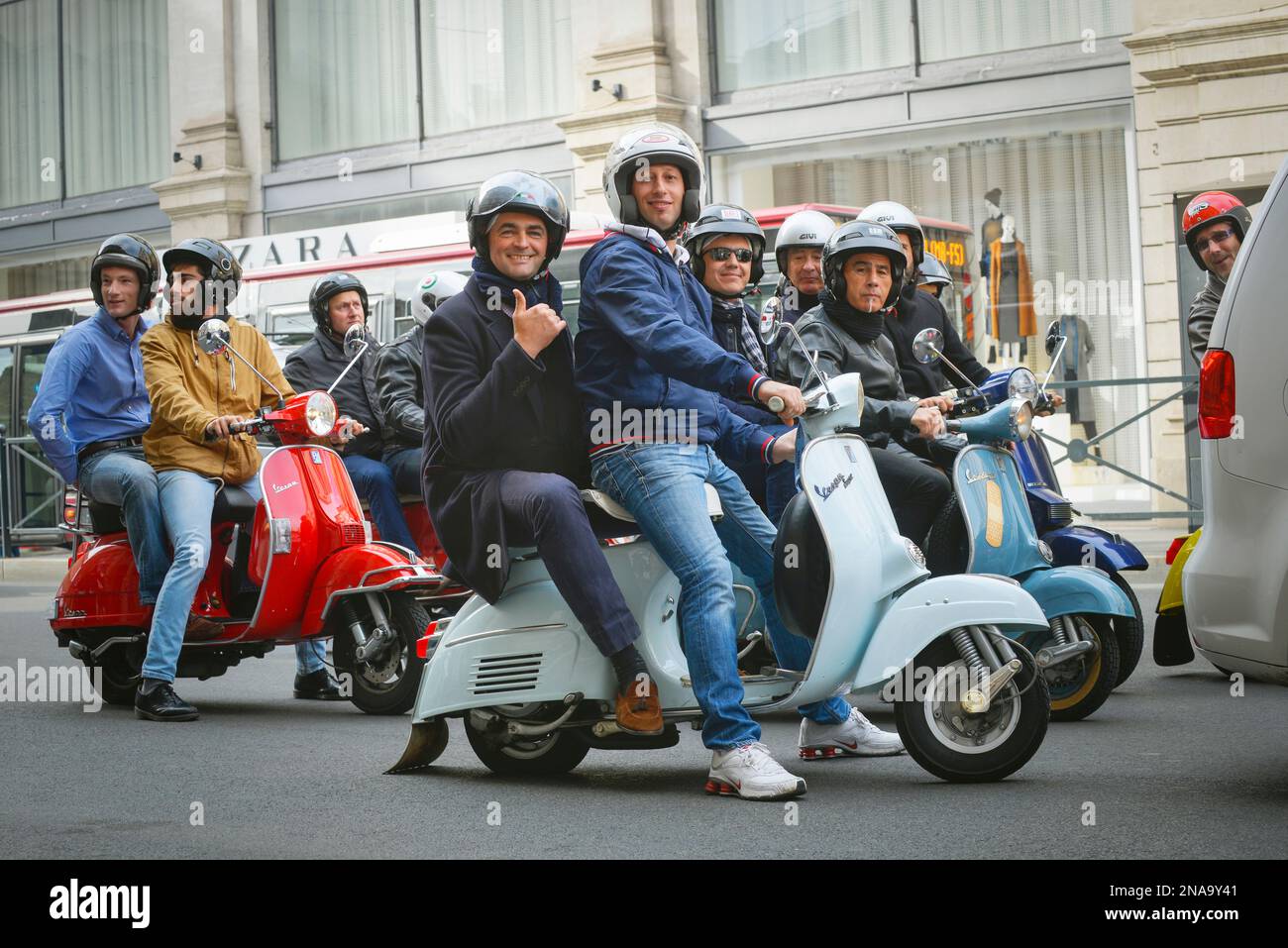 Men on scooters in Rome traffic Stock Photo - Alamy
