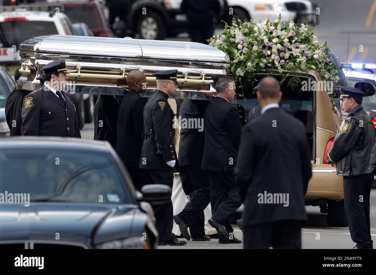 The coffin holding the remains of singer Whitney Houston is carried to ...
