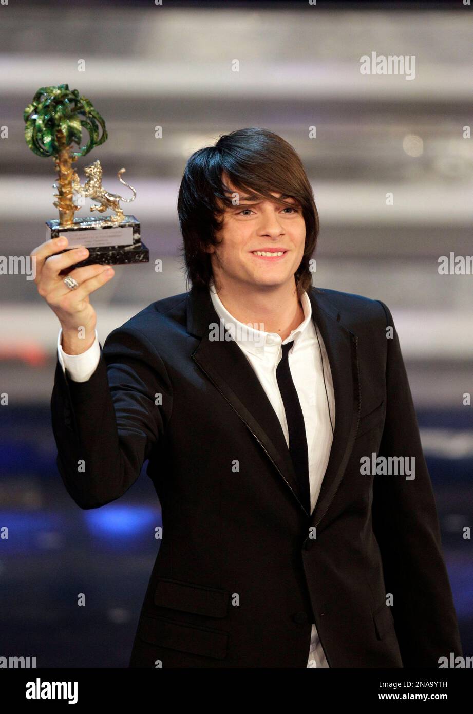 Italian singer Alessandro Casillo holds the trophy after winning the ...