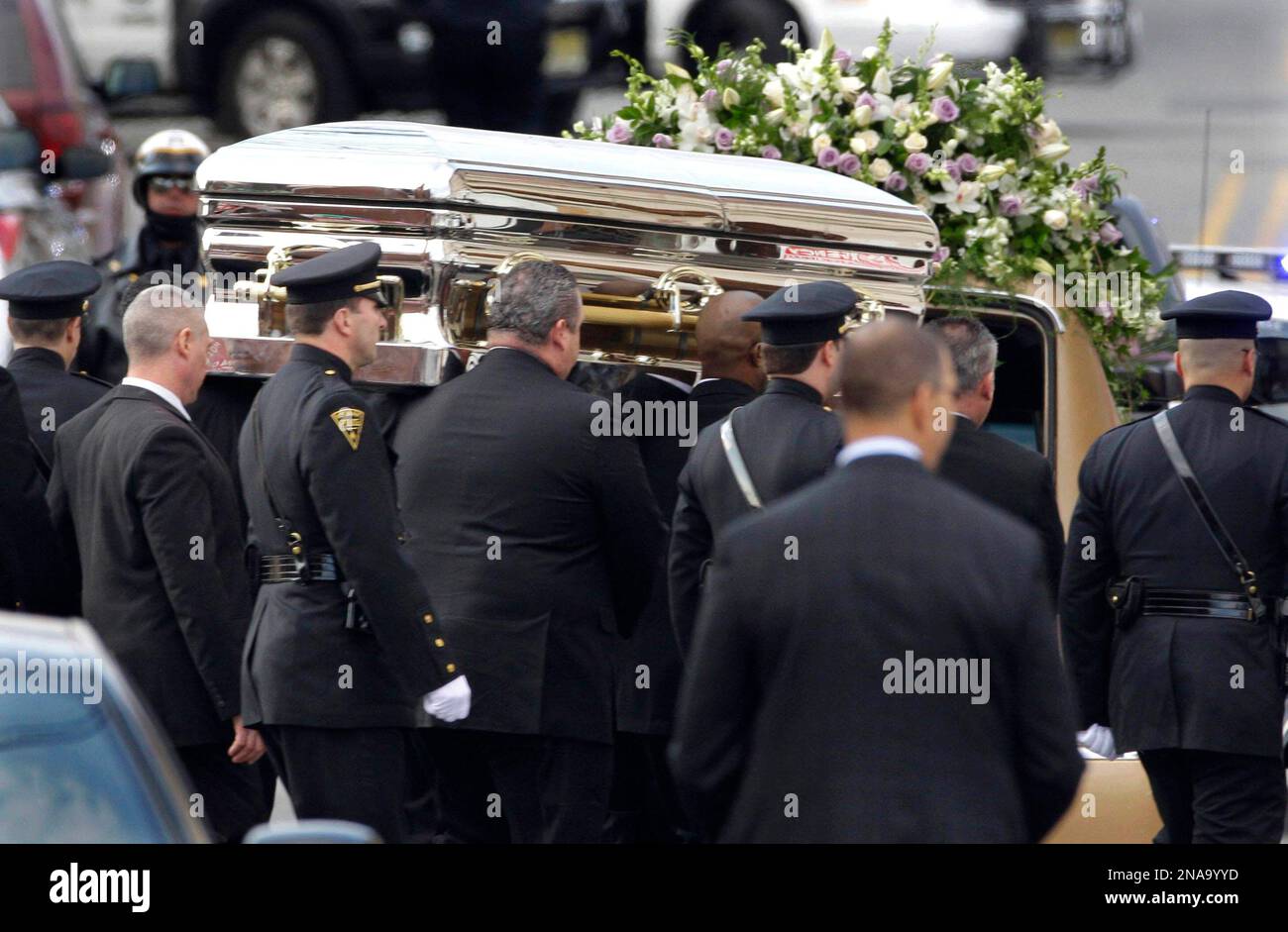The coffin holding the remains of singer Whitney Houston is carried to ...