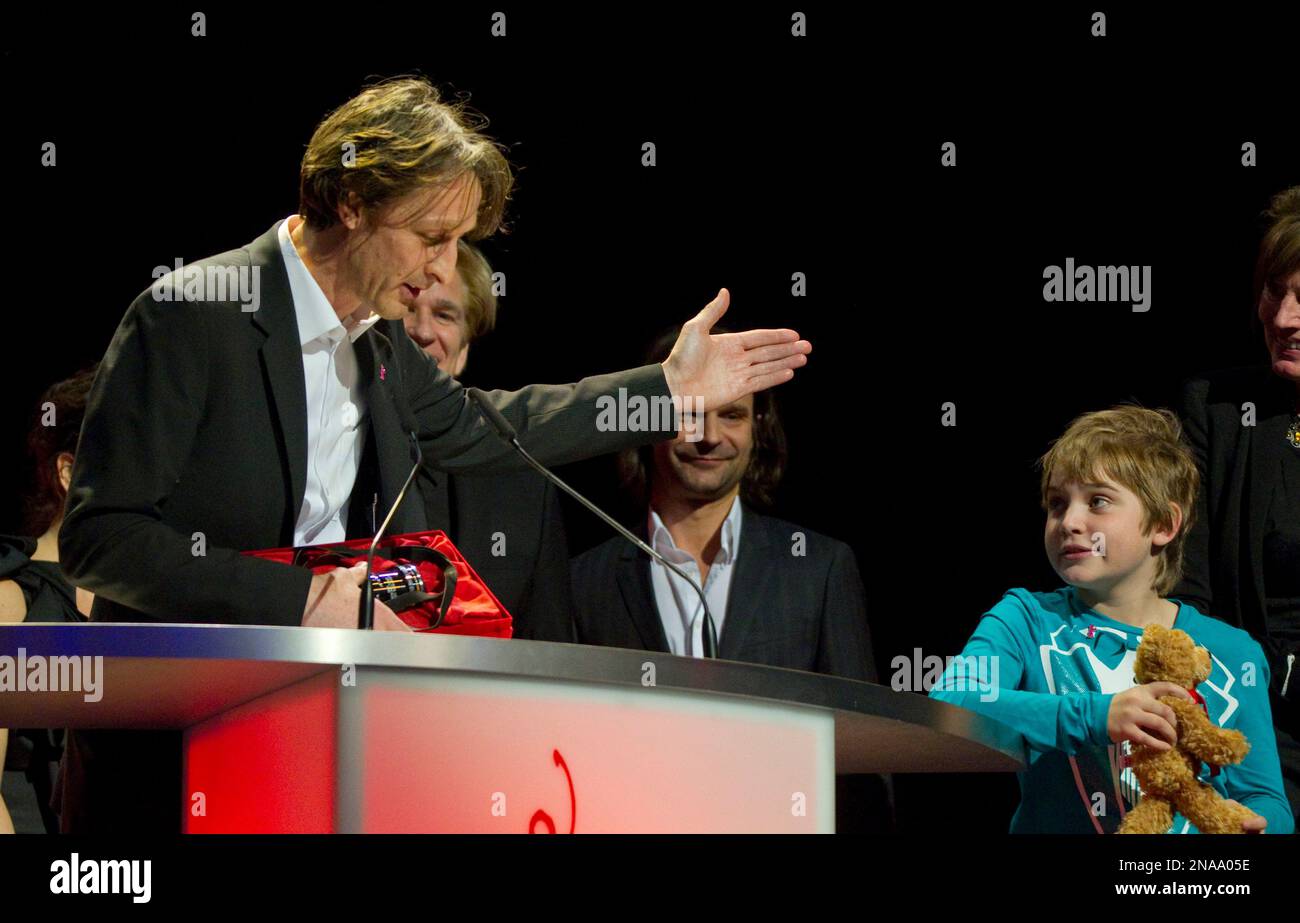 Director Boudewijn Koole, left, speaks on stage next to actor Rick Lens ...