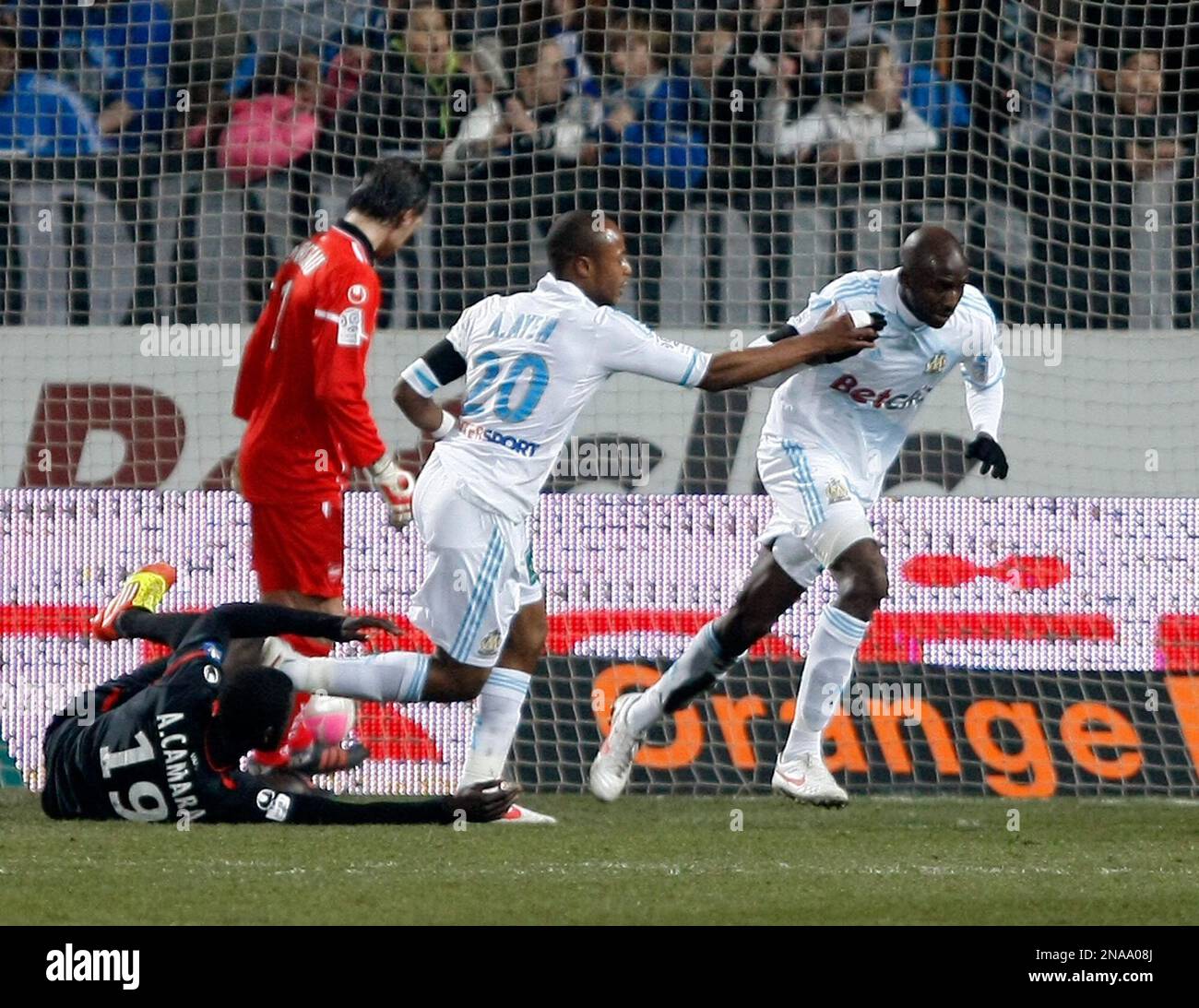 Marseille's French midfielder Alou Diarra, right, reacts with Ghanaian ...
