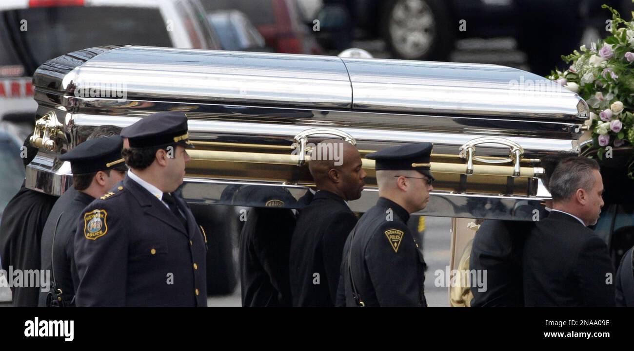 The coffin holding the remains of singer Whitney Houston is carried to ...