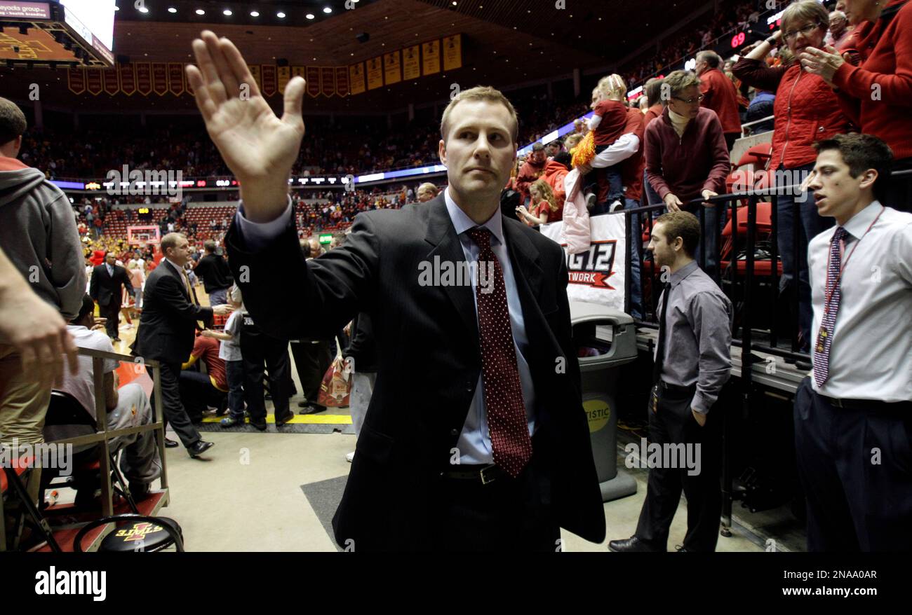 Iowa State head coach Fred Hoiberg waves to fans as he walks of the ...