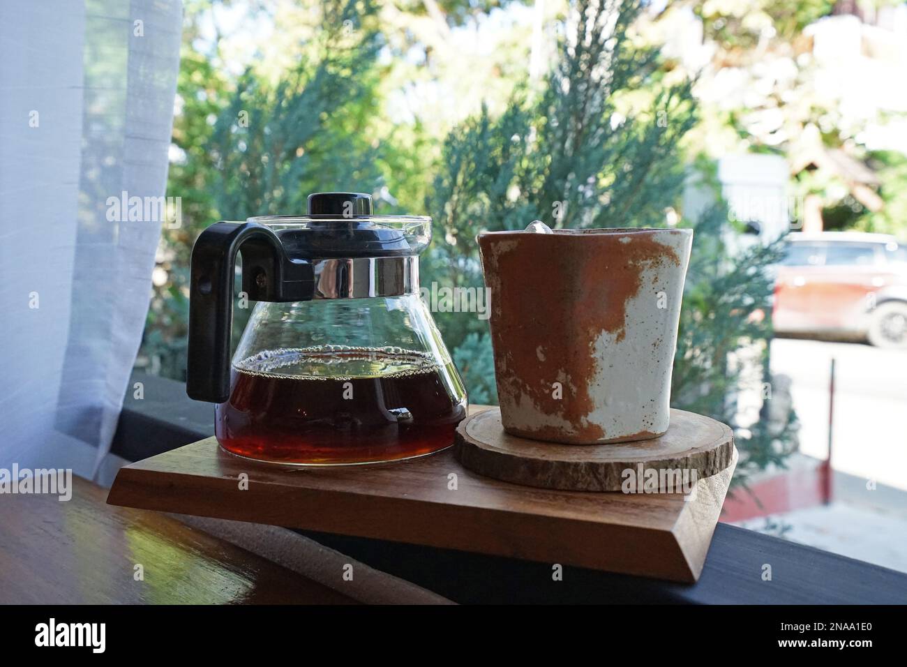 Close up cold drip coffee with ceramic clay cup Stock Photo - Alamy