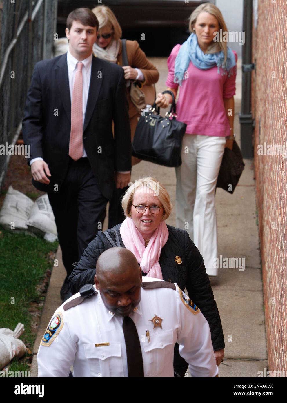 Sharon Love, mother of Yeardley Love, second from bottom, is escorted ...