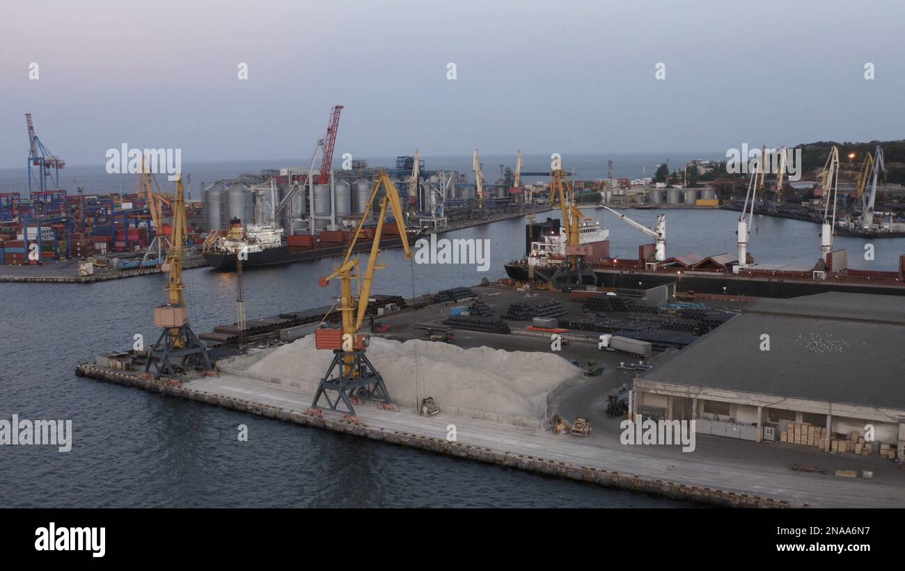 Aerial view of sea port in the evening. Warehouse with grain and tower ...